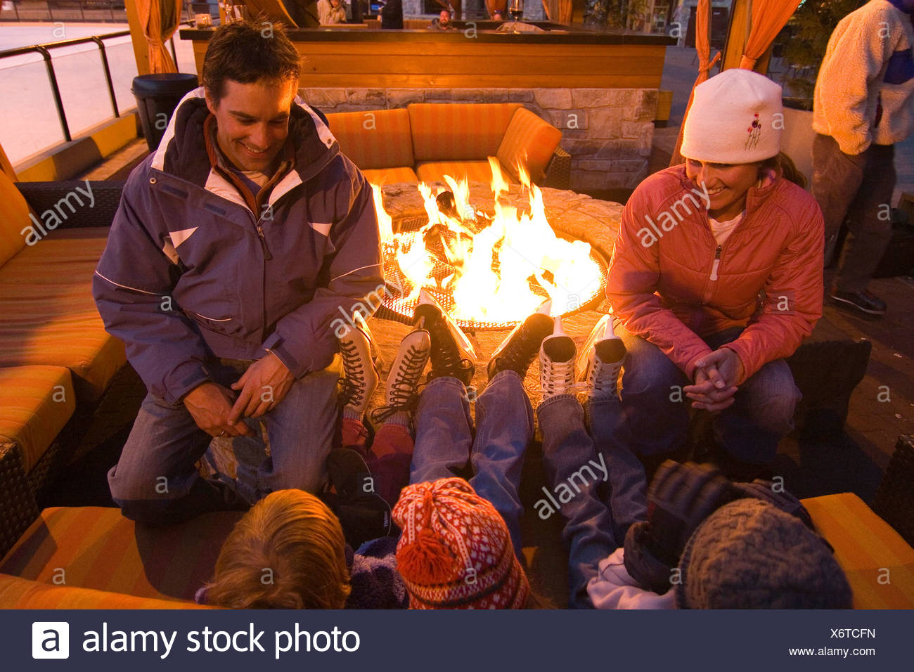 Family Sitting Around Fire High Resolution Stock Photography and Images ...