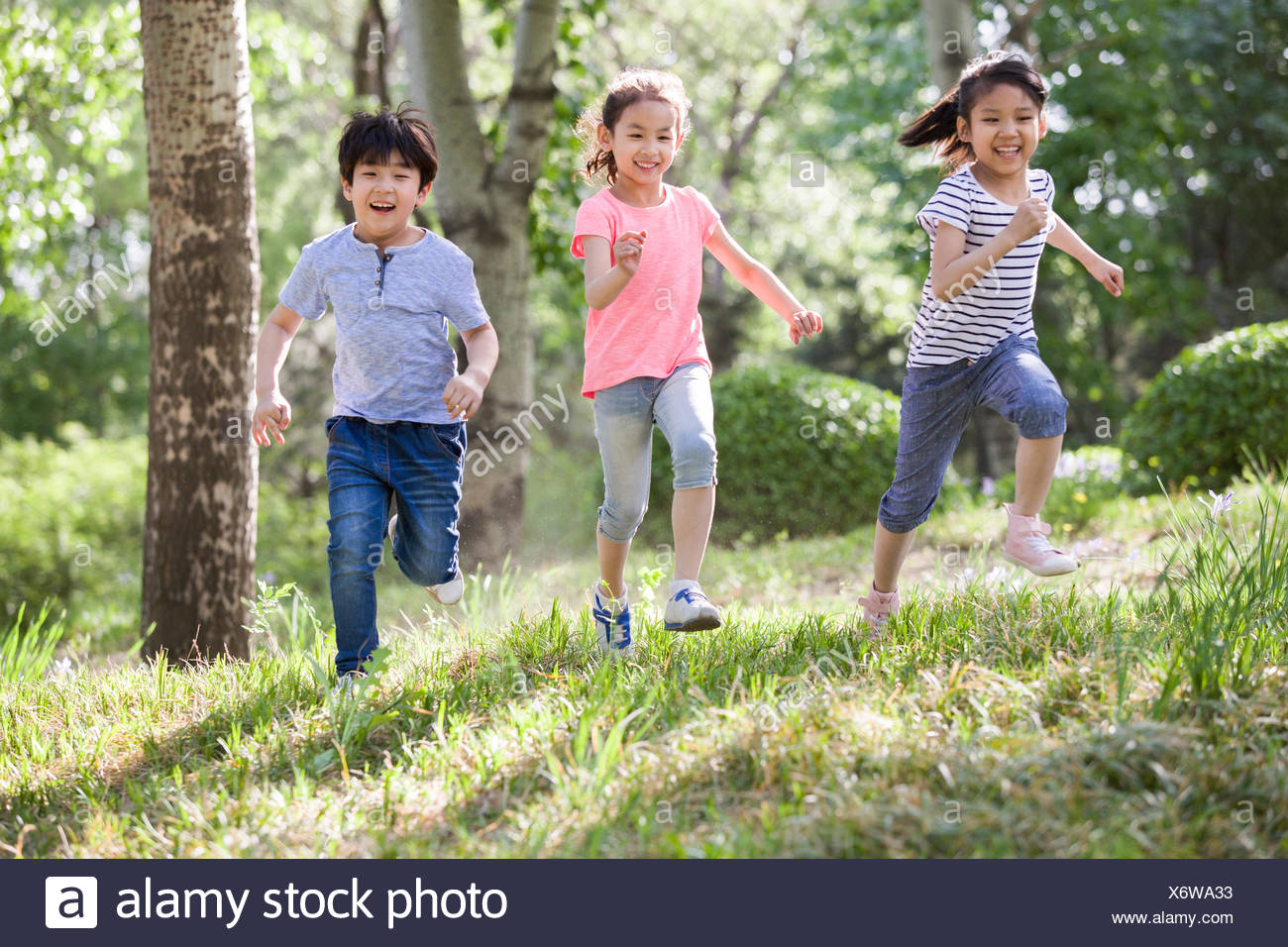 Happy Indian Child Running In The Grass High Resolution Stock ...