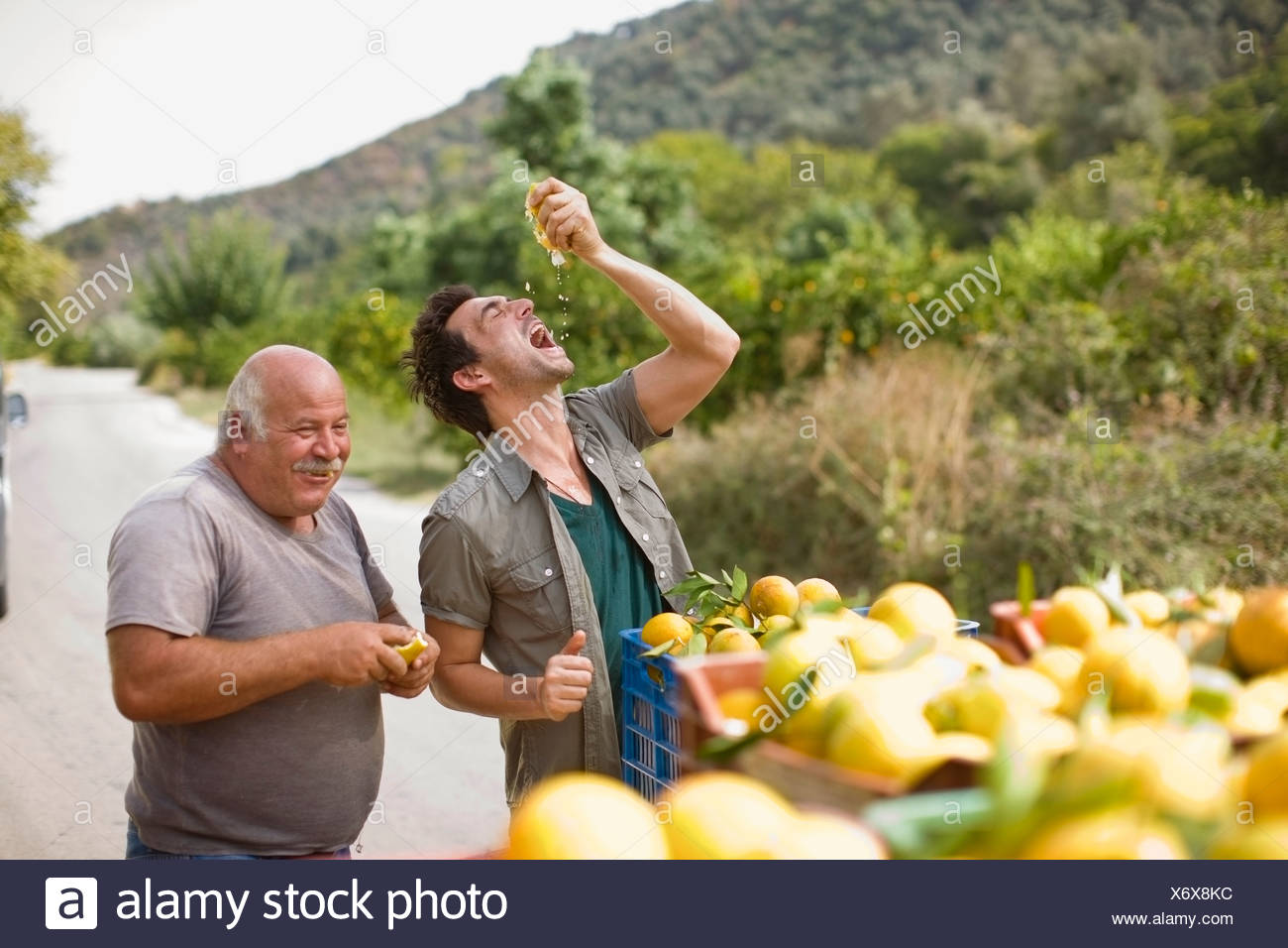 Man Squeezing Fruit High Resolution Stock Photography and Images - Alamy