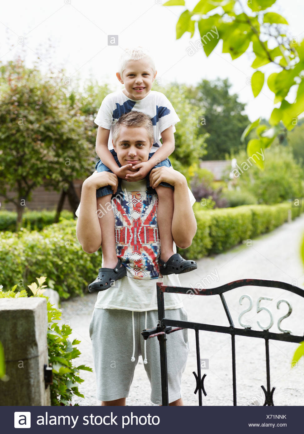 Carrying Younger Sibling High Resolution Stock Photography and Images ...