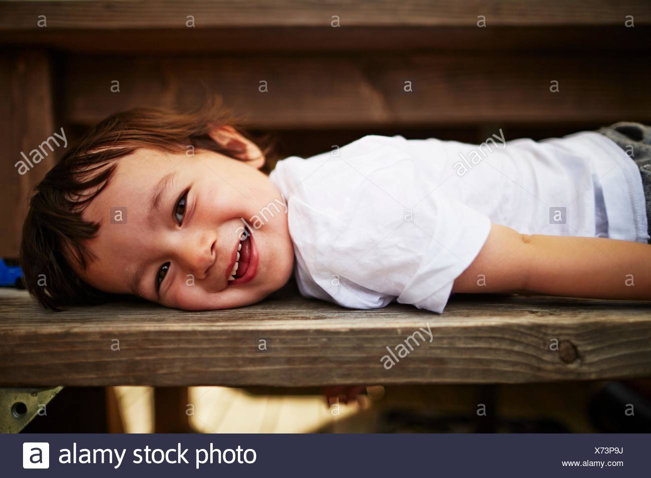 Boy Lying Down On Bench High Resolution Stock Photography and Images ...
