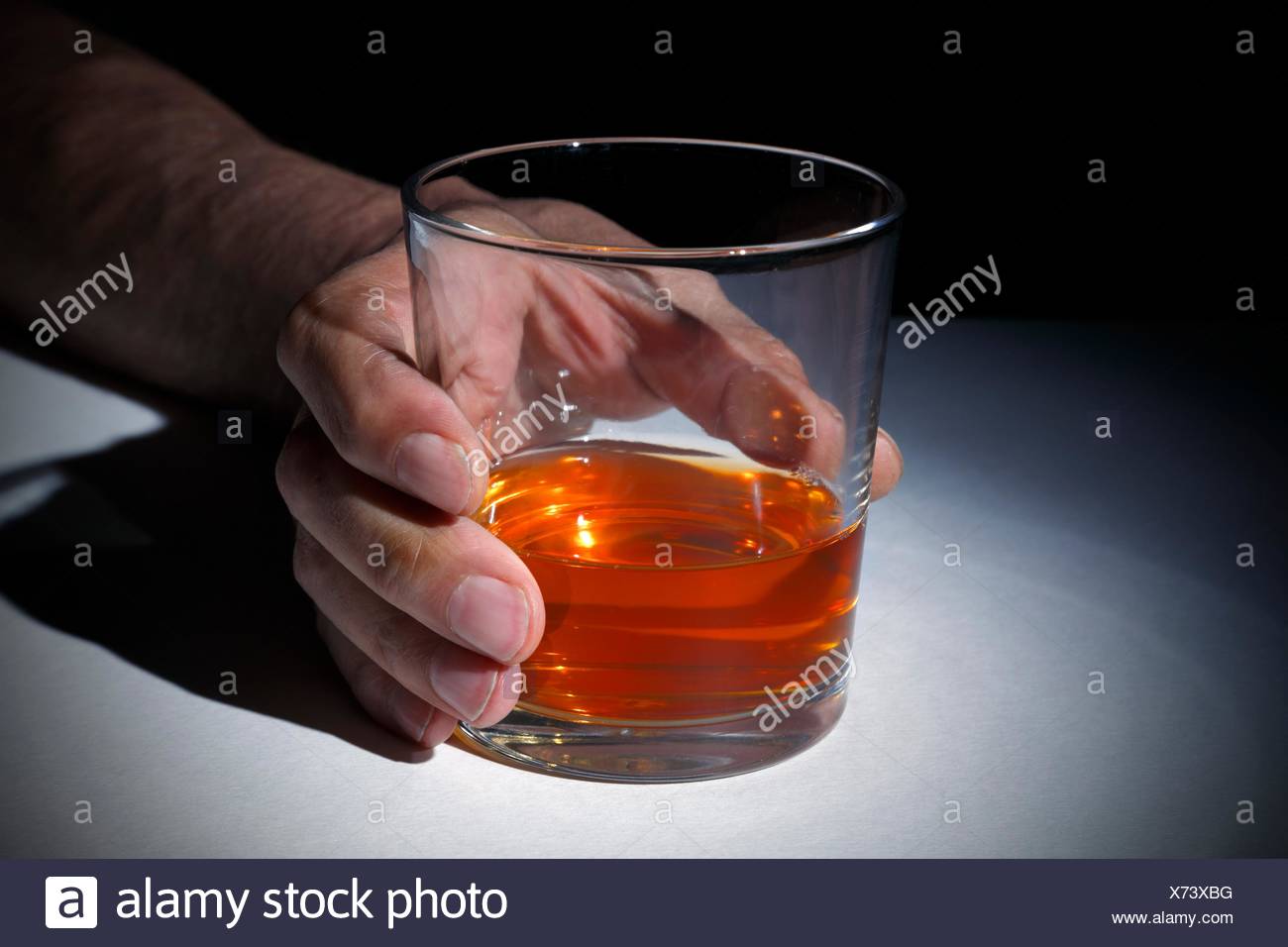 Hand Holding Whisky Glass Stock Photos & Hand Holding Whisky Glass ...