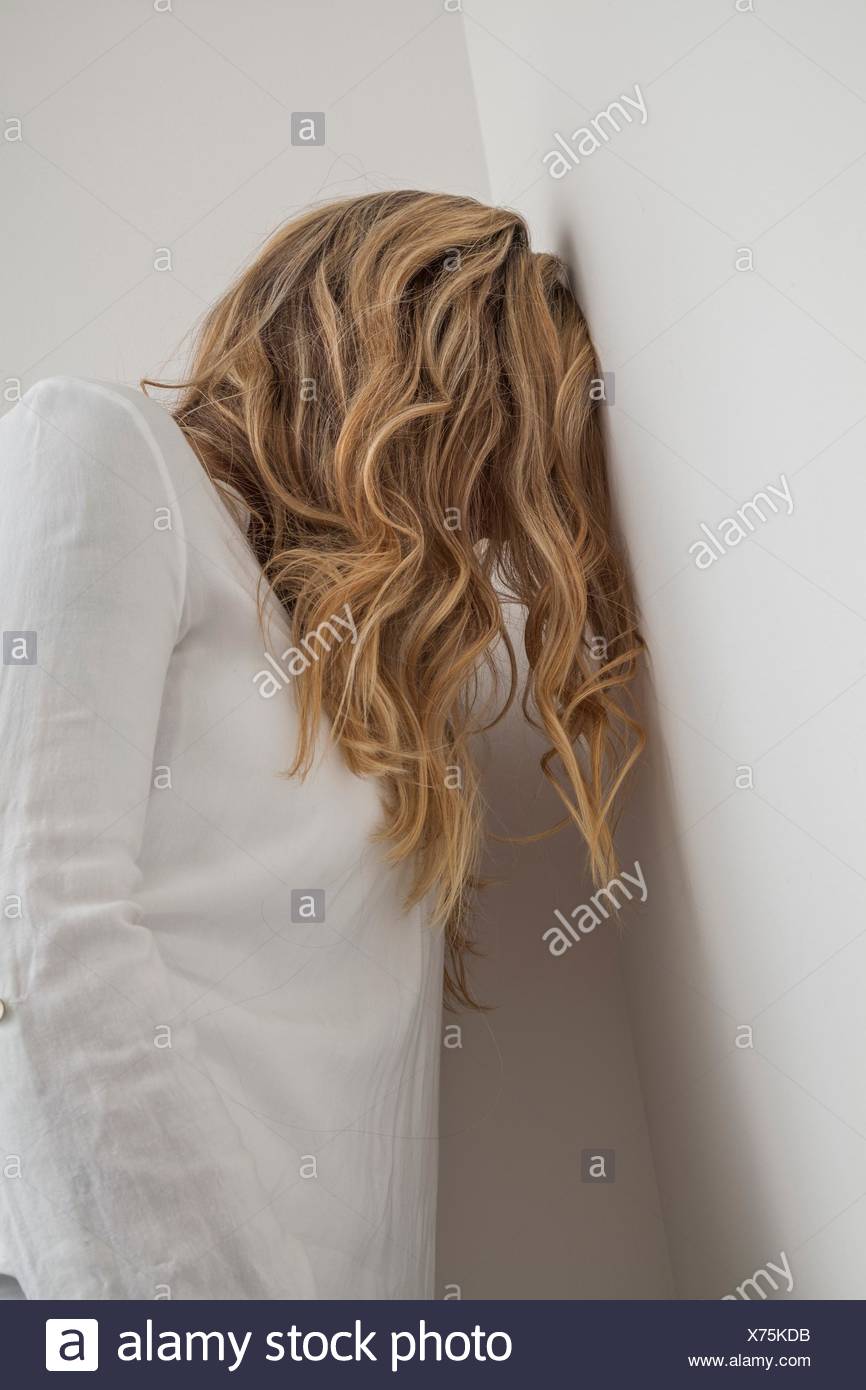 Woman Leaning Head Against Side Stock Photos & Woman Leaning Head ...