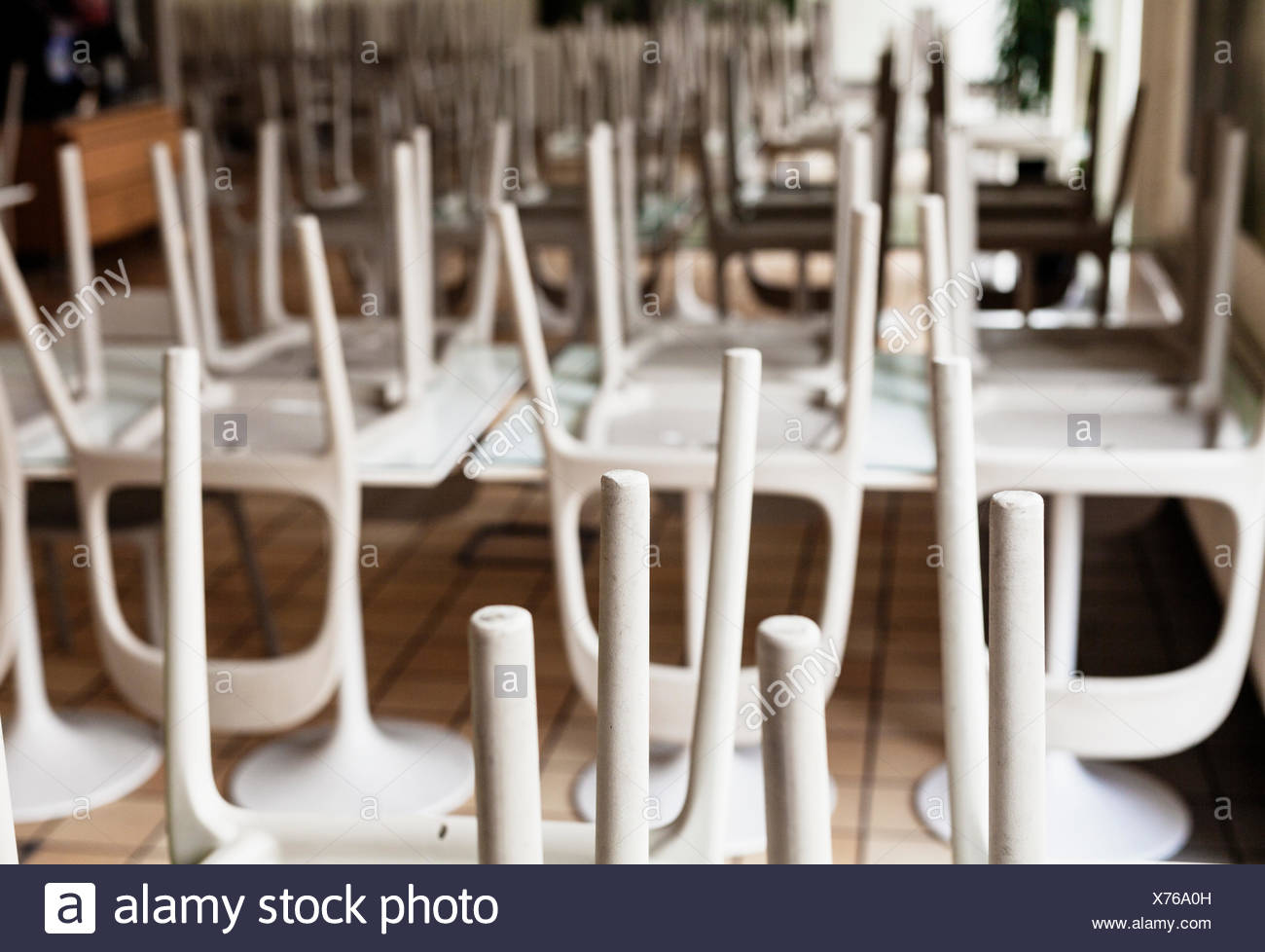 Upside Down Chairs On Table Stock Photos & Upside Down Chairs On Table ...