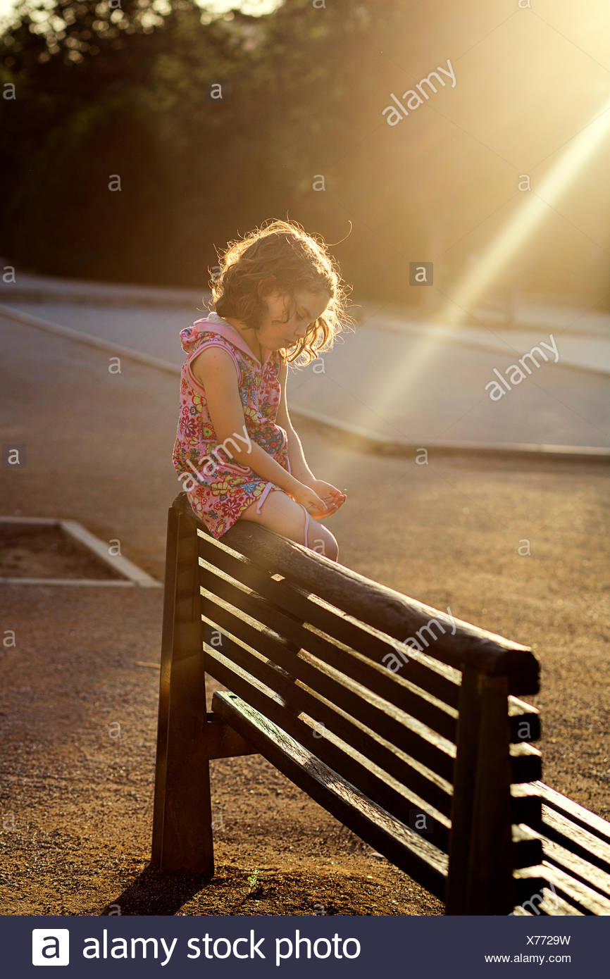 Girl Child Bench Sitting Park High Resolution Stock Photography and ...