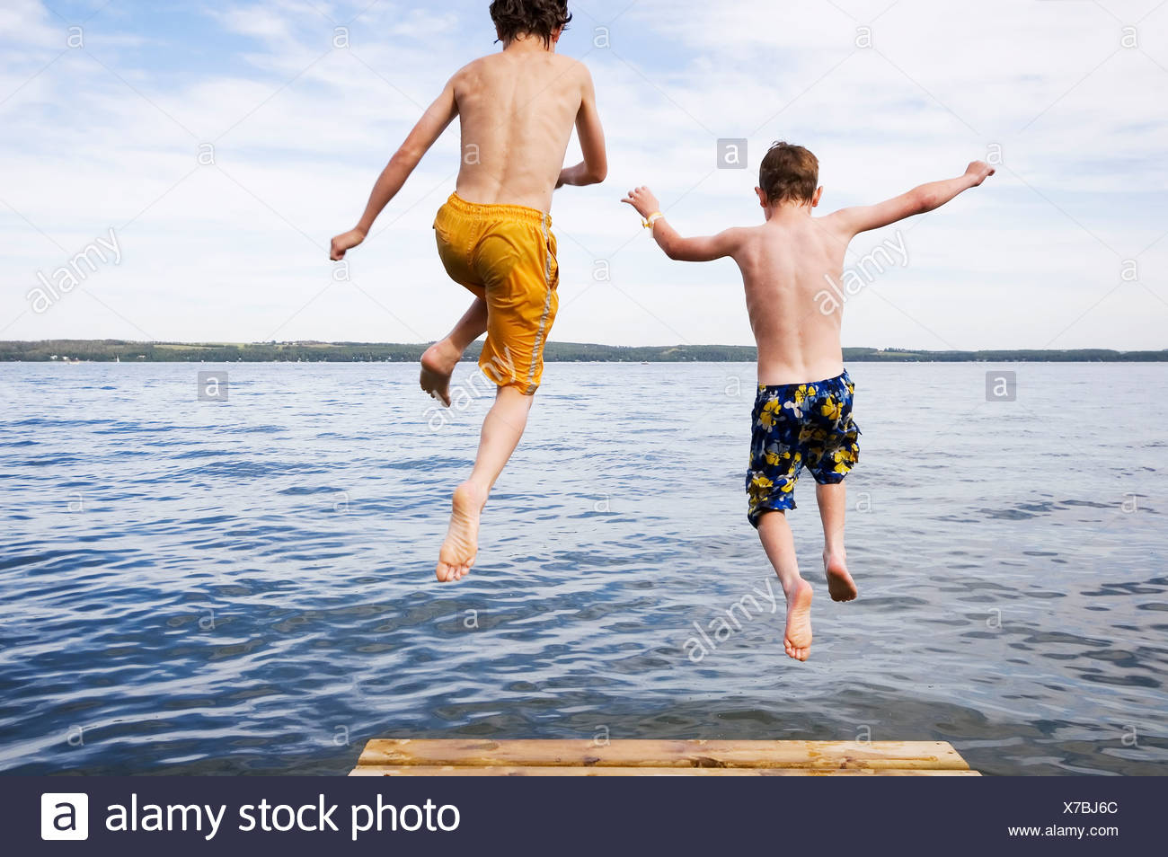 Boy Jumping Off Dock Lake High Resolution Stock Photography and Images ...