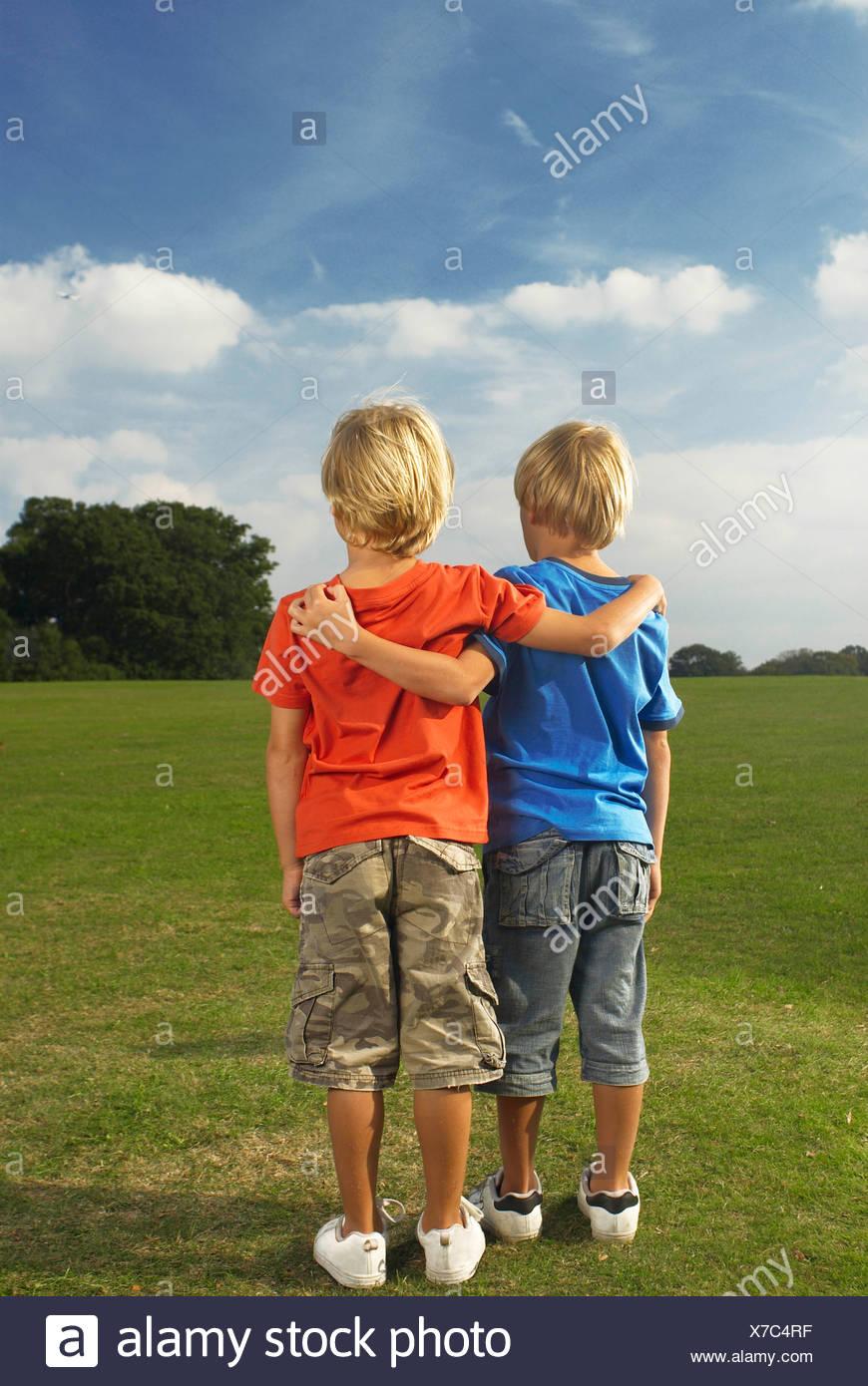 Two Boys With Arms Around Each Other High Resolution Stock Photography ...