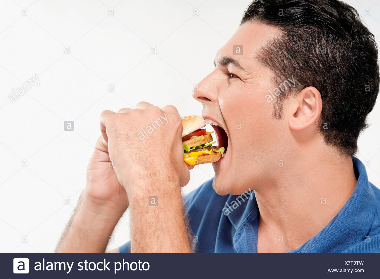 Biting Into Hamburger Stock Photos & Biting Into Hamburger Stock Images ...
