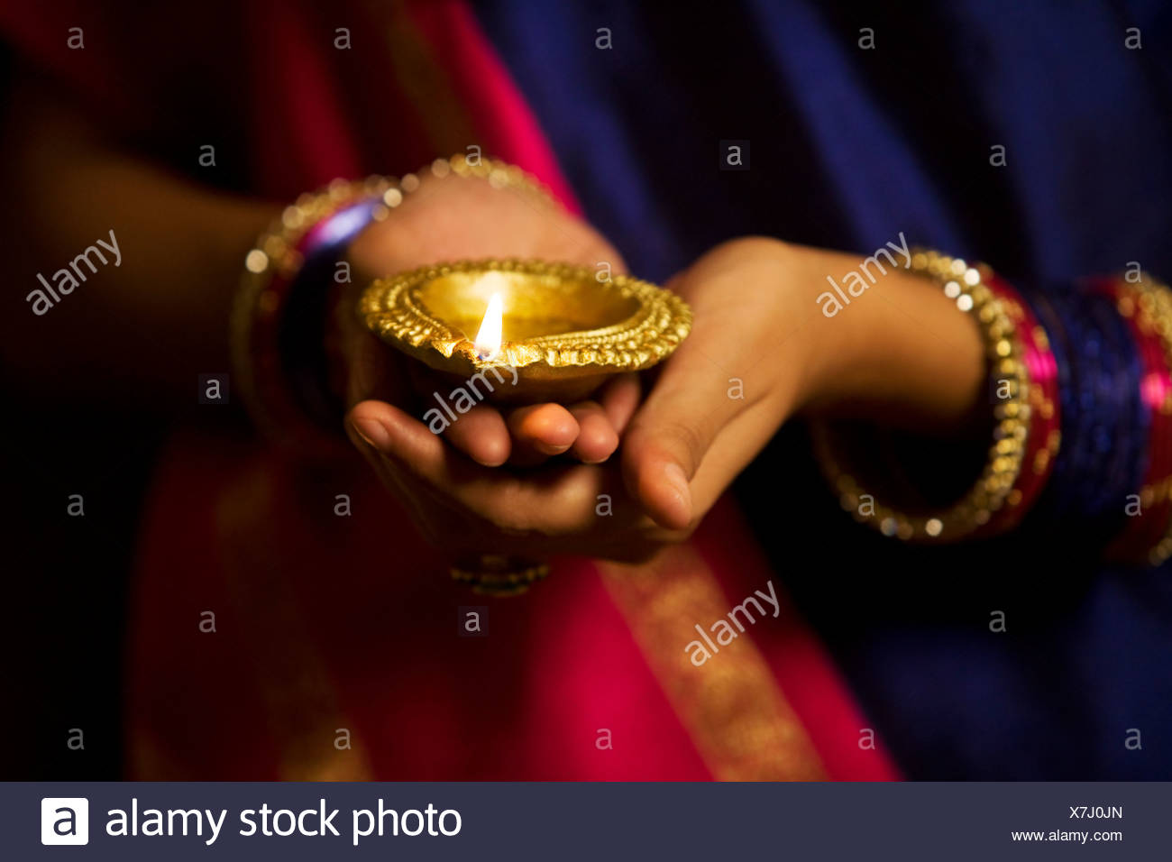 Woman Holding Diya High Resolution Stock Photography and Images - Alamy
