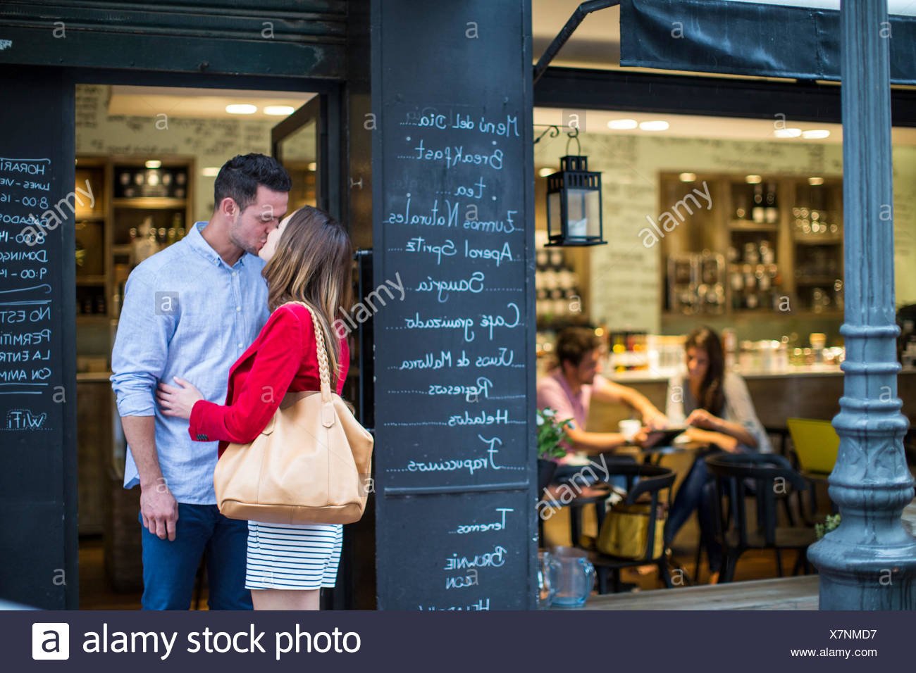 Couple Kissing In Cafe High Resolution Stock Photography and Images - Alamy