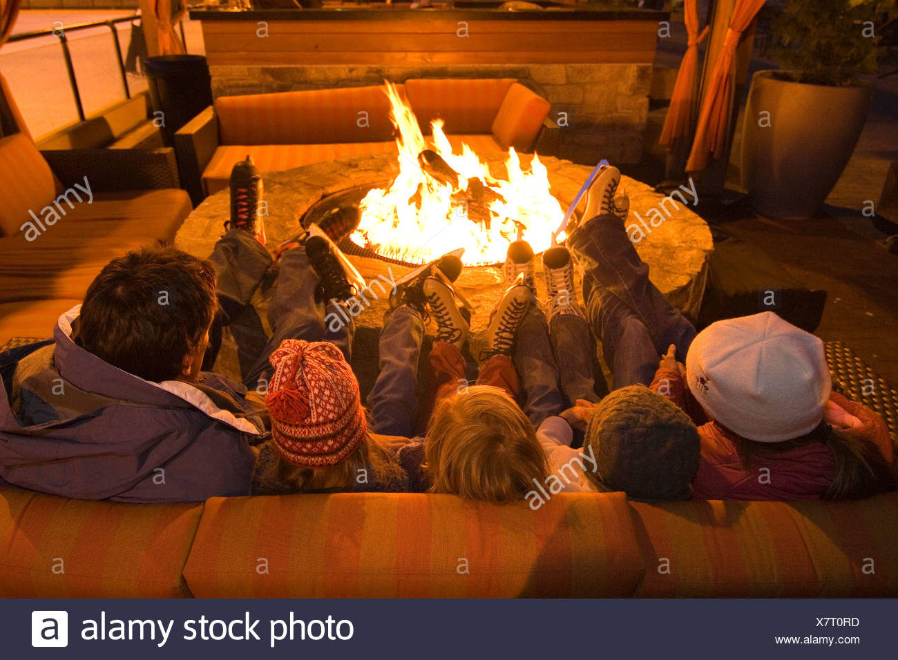 Family Sitting Around Fire High Resolution Stock Photography and Images ...