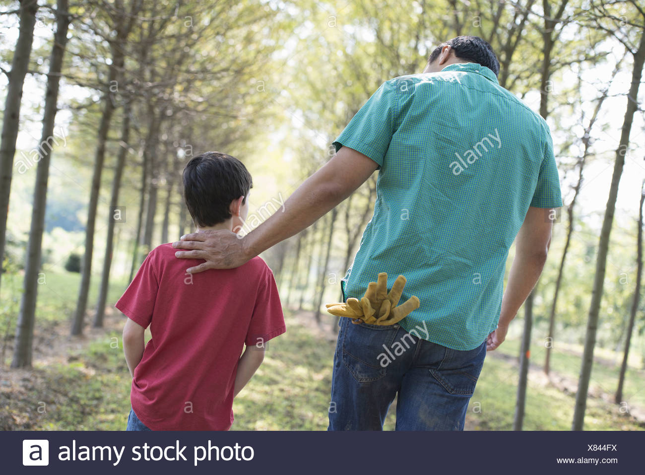 Father And Son Walking Down A Road High Resolution Stock Photography ...