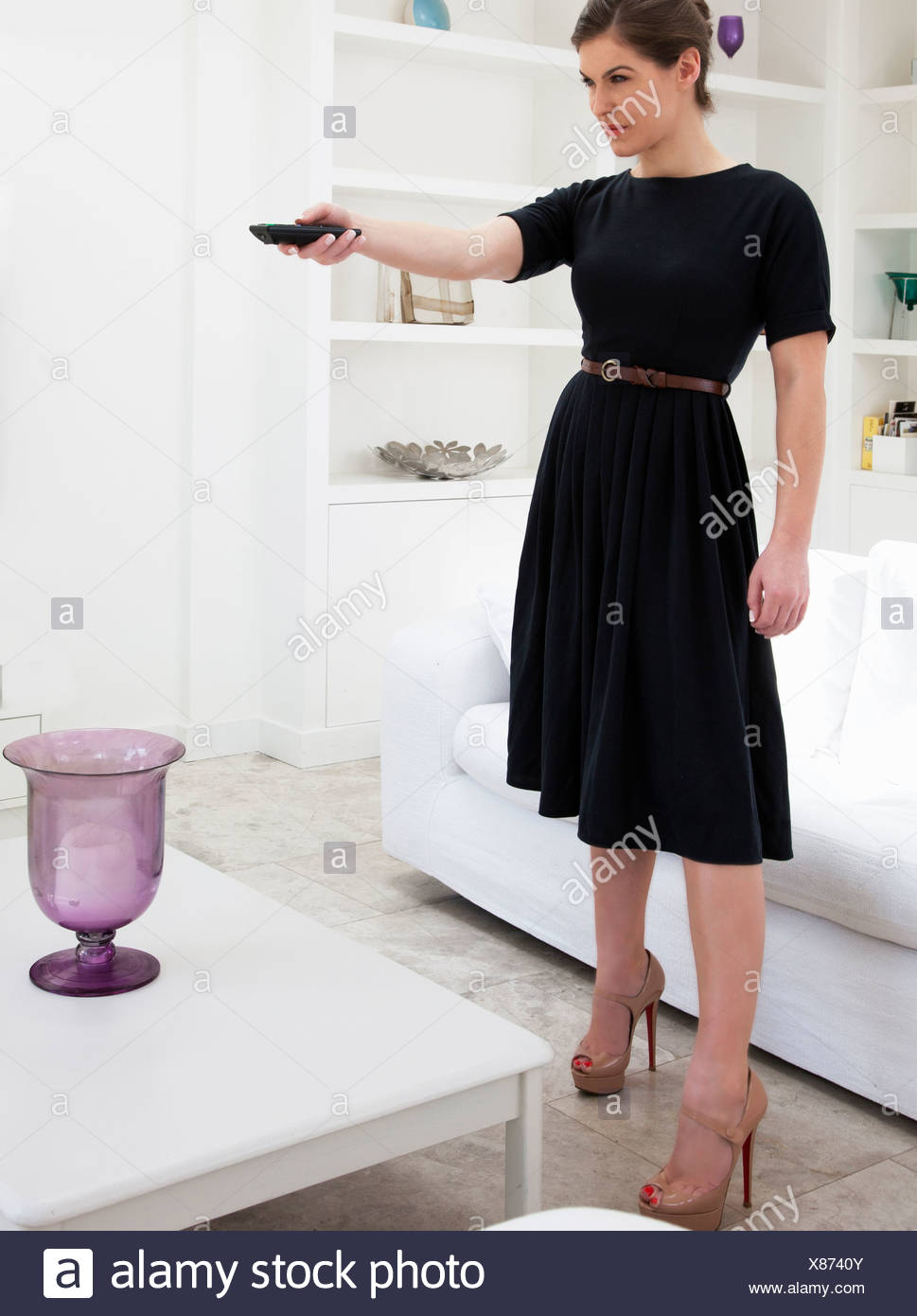 Person Using Remote Control High Resolution Stock Photography and ...