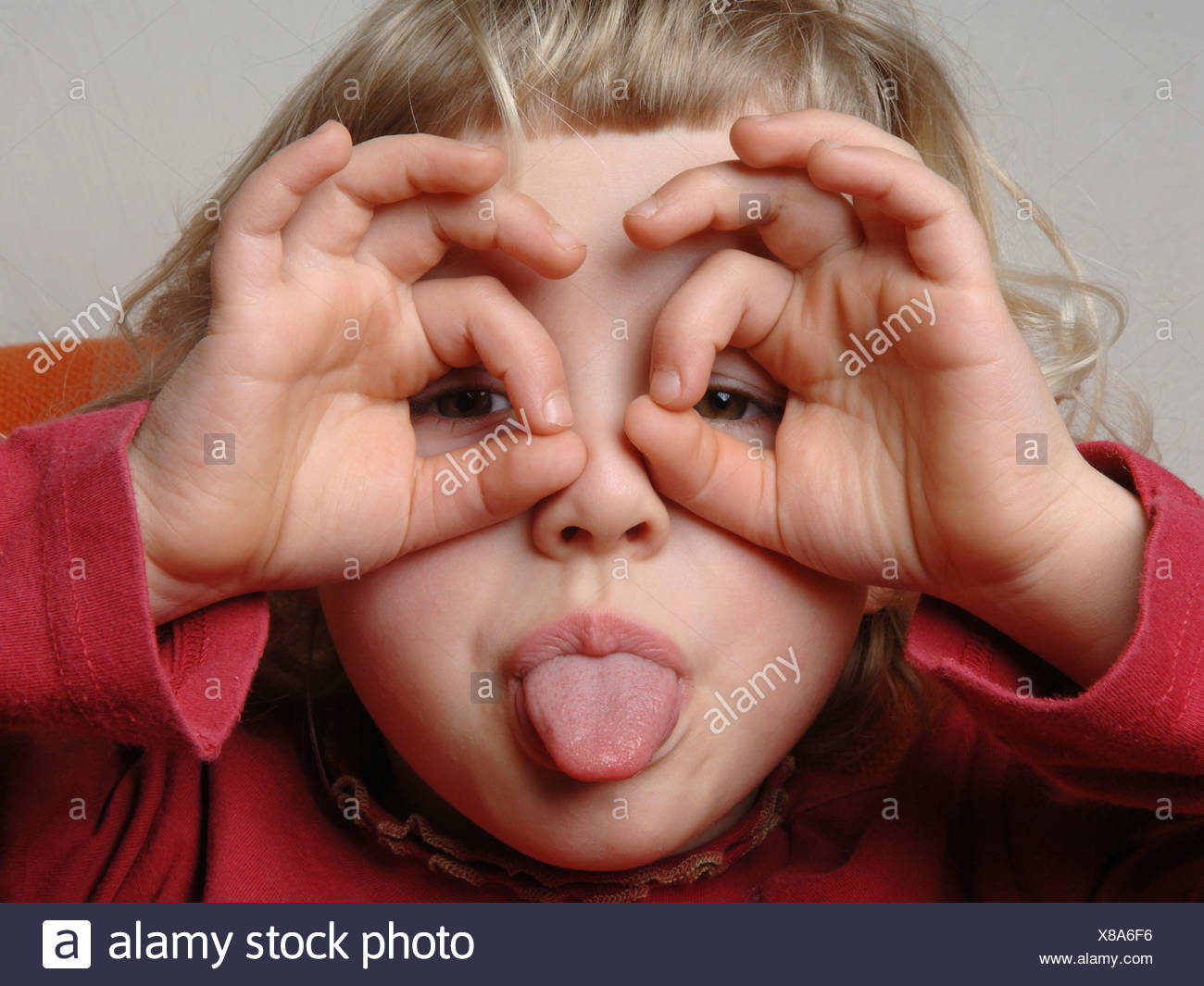 Child Tongue Out Fingers High Resolution Stock Photography and Images ...