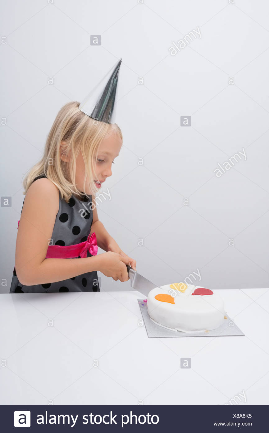 Girl Cutting Birthday Cake High Resolution Stock Photography and Images ...