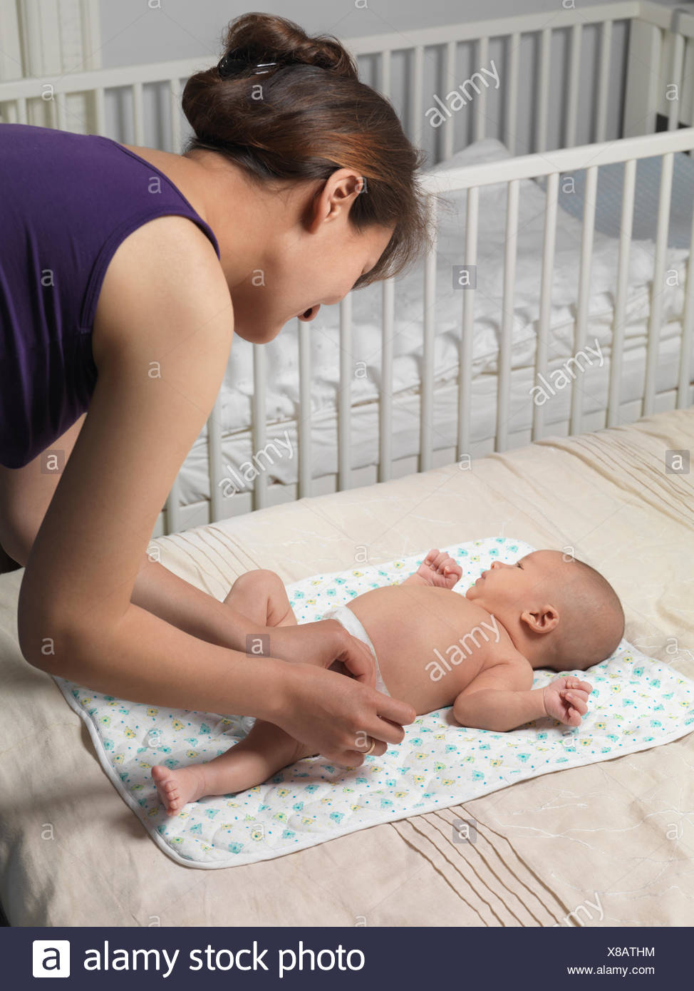 Mum Changing A Baby High Resolution Stock Photography and Images - Alamy