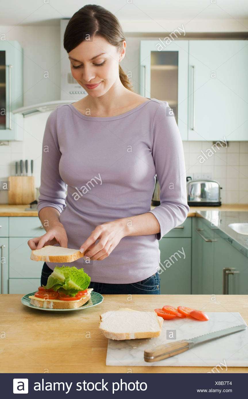 Woman Making Sandwich Kitchen High Resolution Stock Photography and ...