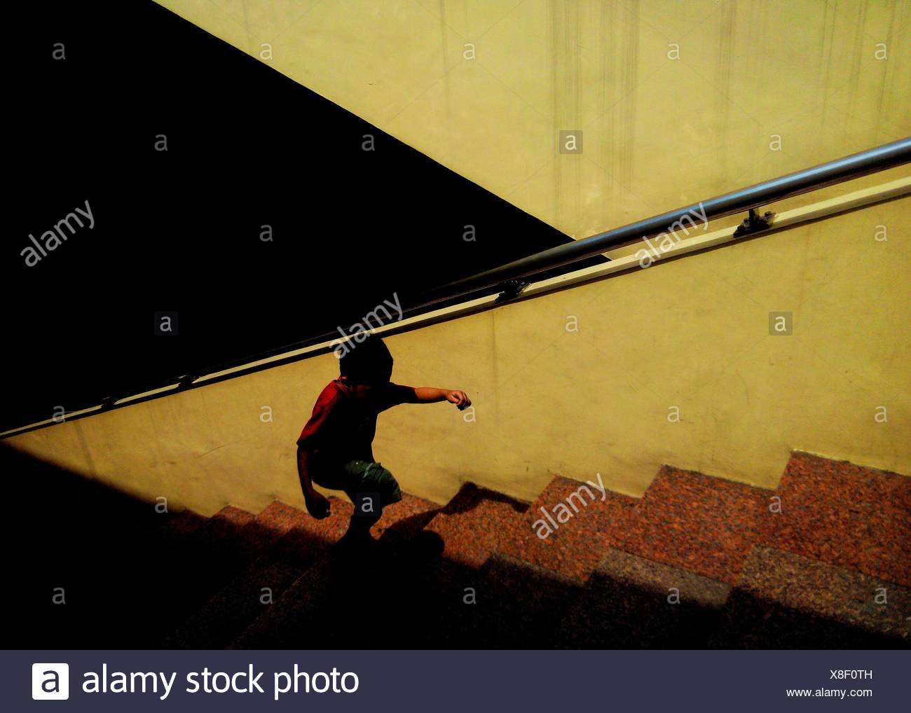 Boy Walking Up Stairs High Resolution Stock Photography and Images - Alamy