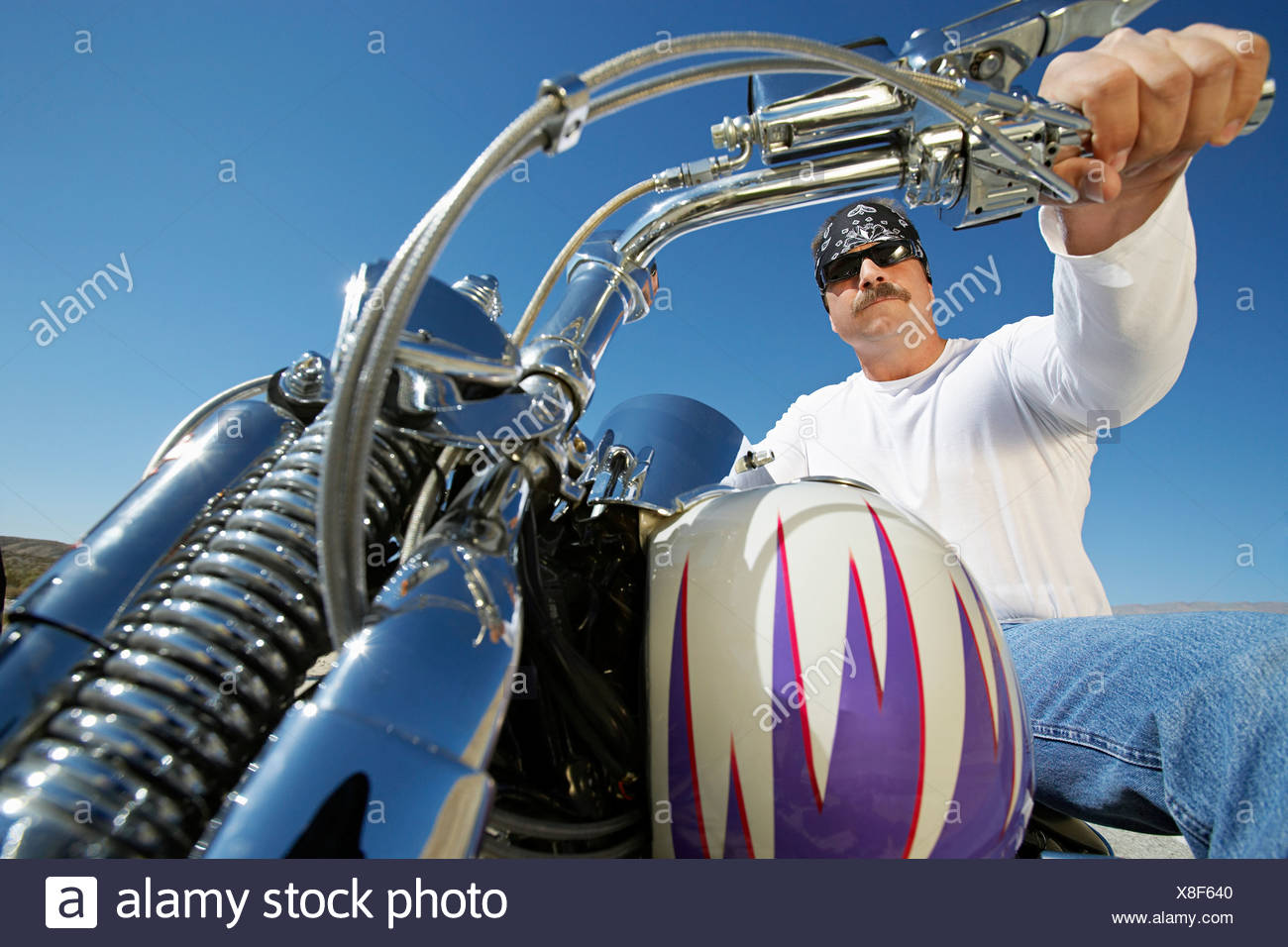 Biker Riding Motorcycle Low Angle High Resolution Stock Photography and ...