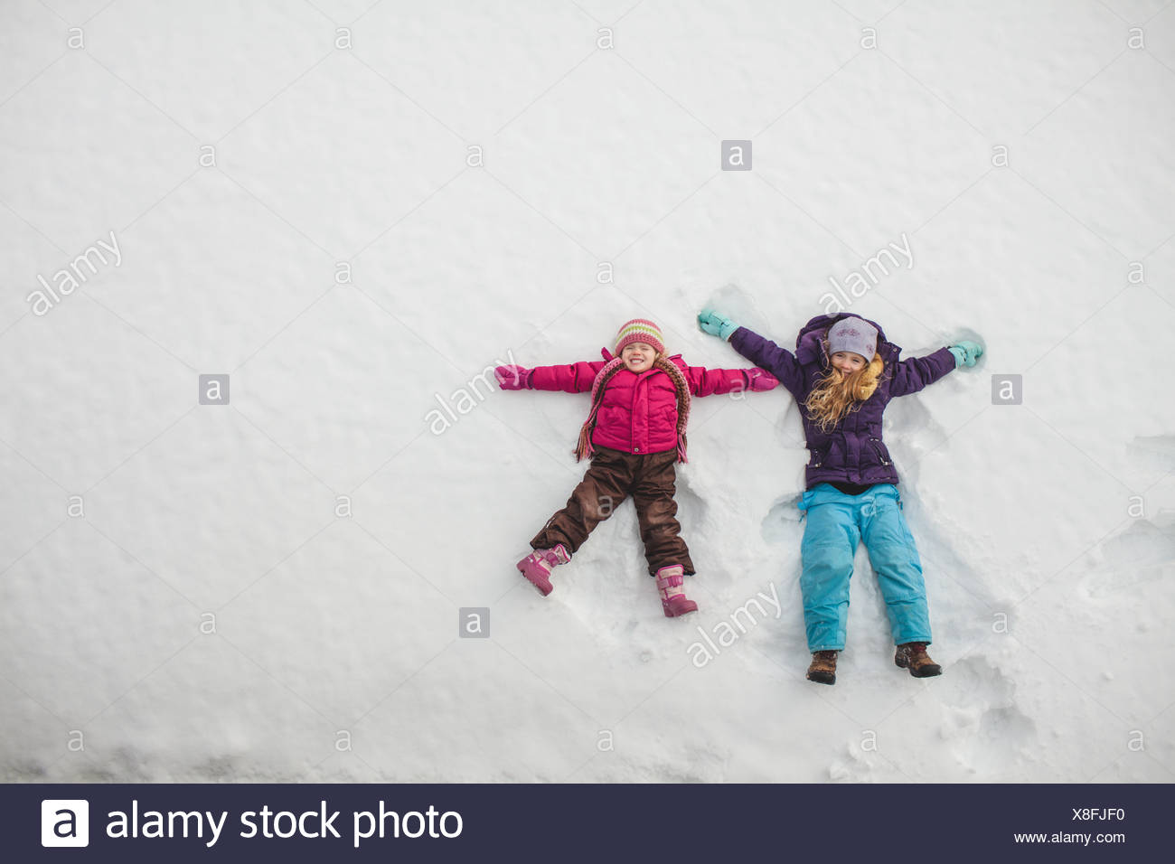 Children Making Snow Angels High Resolution Stock Photography and ...