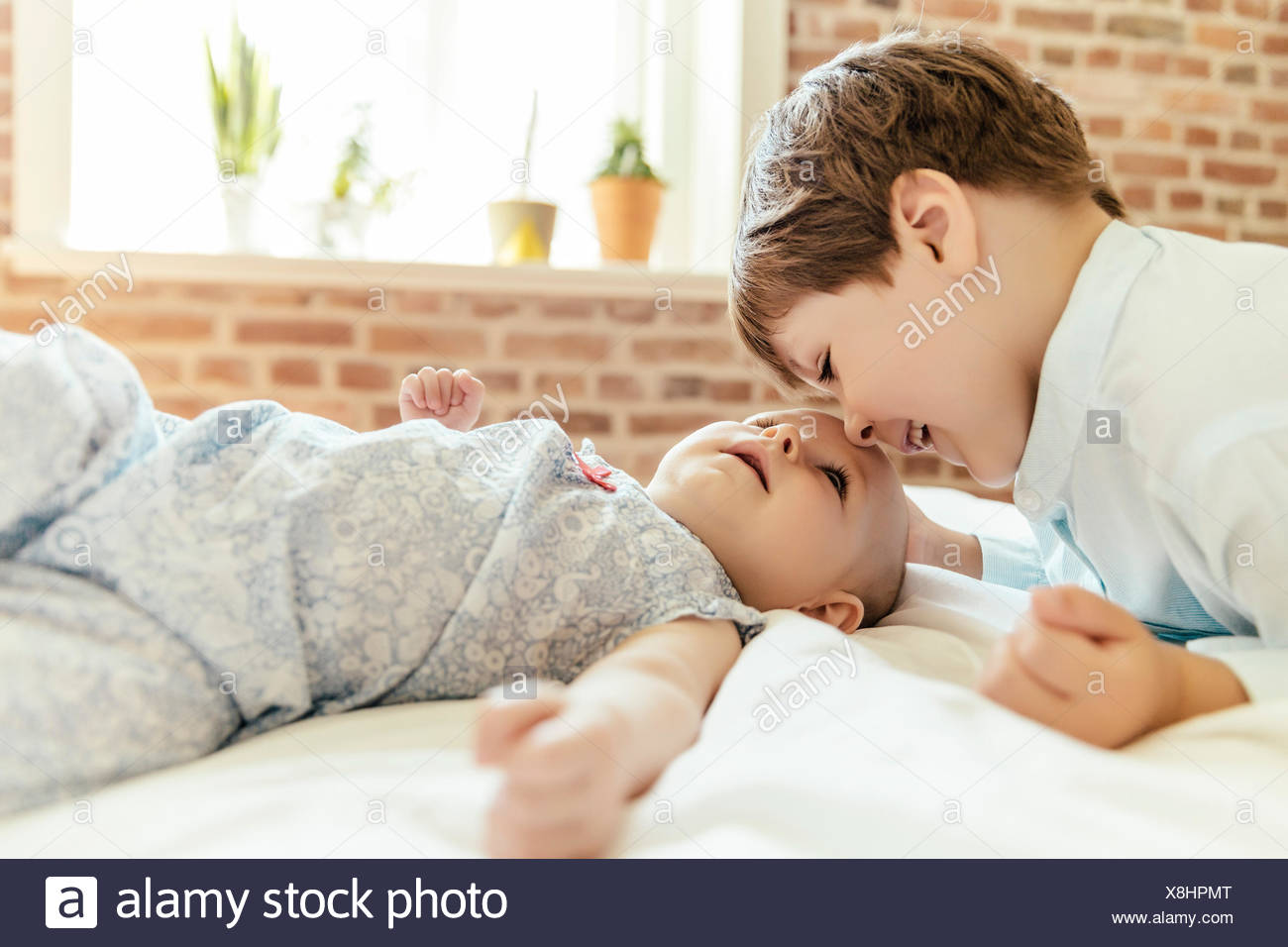 Brother Sister Cuddling High Resolution Stock Photography and Images - Alamy