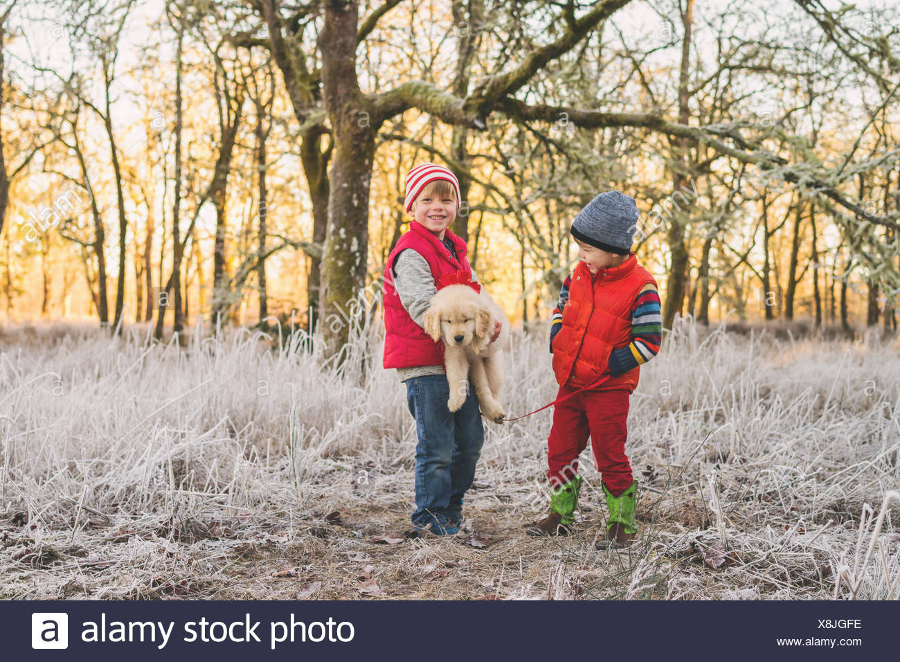 Two People With A Dog High Resolution Stock Photography and Images - Alamy