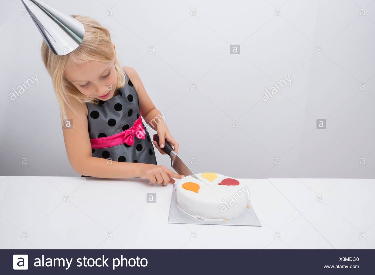 Girl Cutting Birthday Cake High Resolution Stock Photography and Images ...