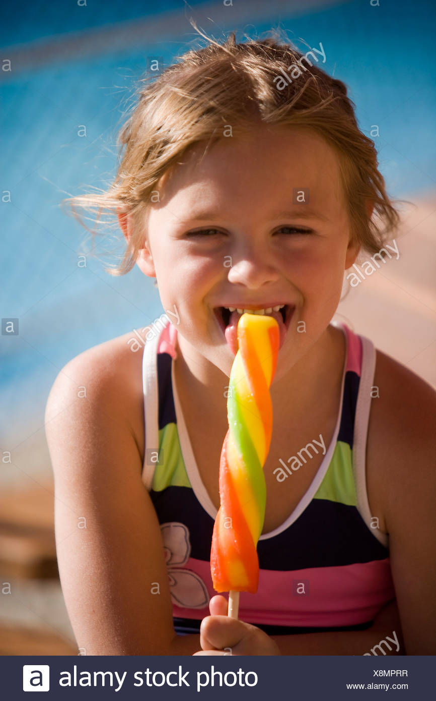 Girl Licking Popsicle High Resolution Stock Photography and Images - Alamy