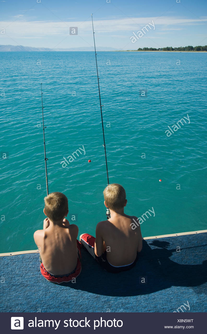 Boy Fishing Off Dock In Stock Photos & Boy Fishing Off Dock In Stock ...
