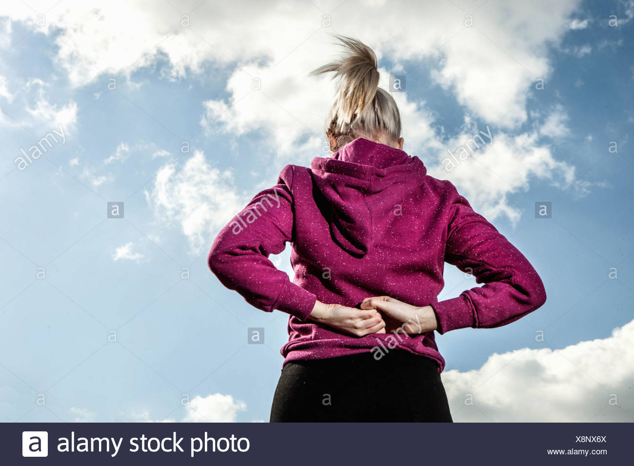 Woman Hands Clasped Behind Back High Resolution Stock Photography and ...