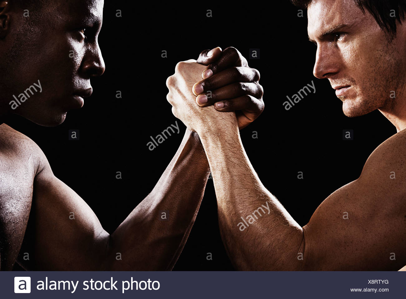 Two Young Men Arm Wrestling Stock Photos & Two Young Men Arm Wrestling ...