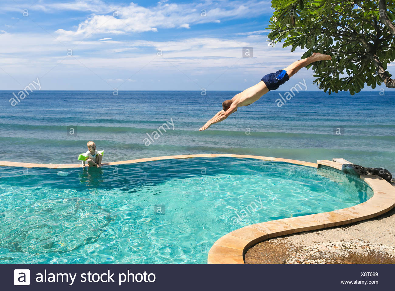 Father With His Son In A Swimming Pool High Resolution Stock ...