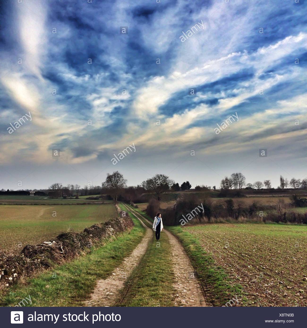 Woman Country Lane Walking Stock Photos & Woman Country Lane Walking ...