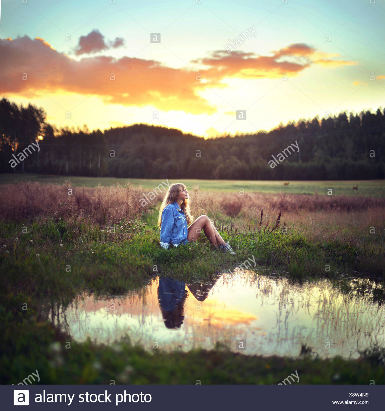 Young Woman Sitting In Water Stock Photos & Young Woman Sitting In ...