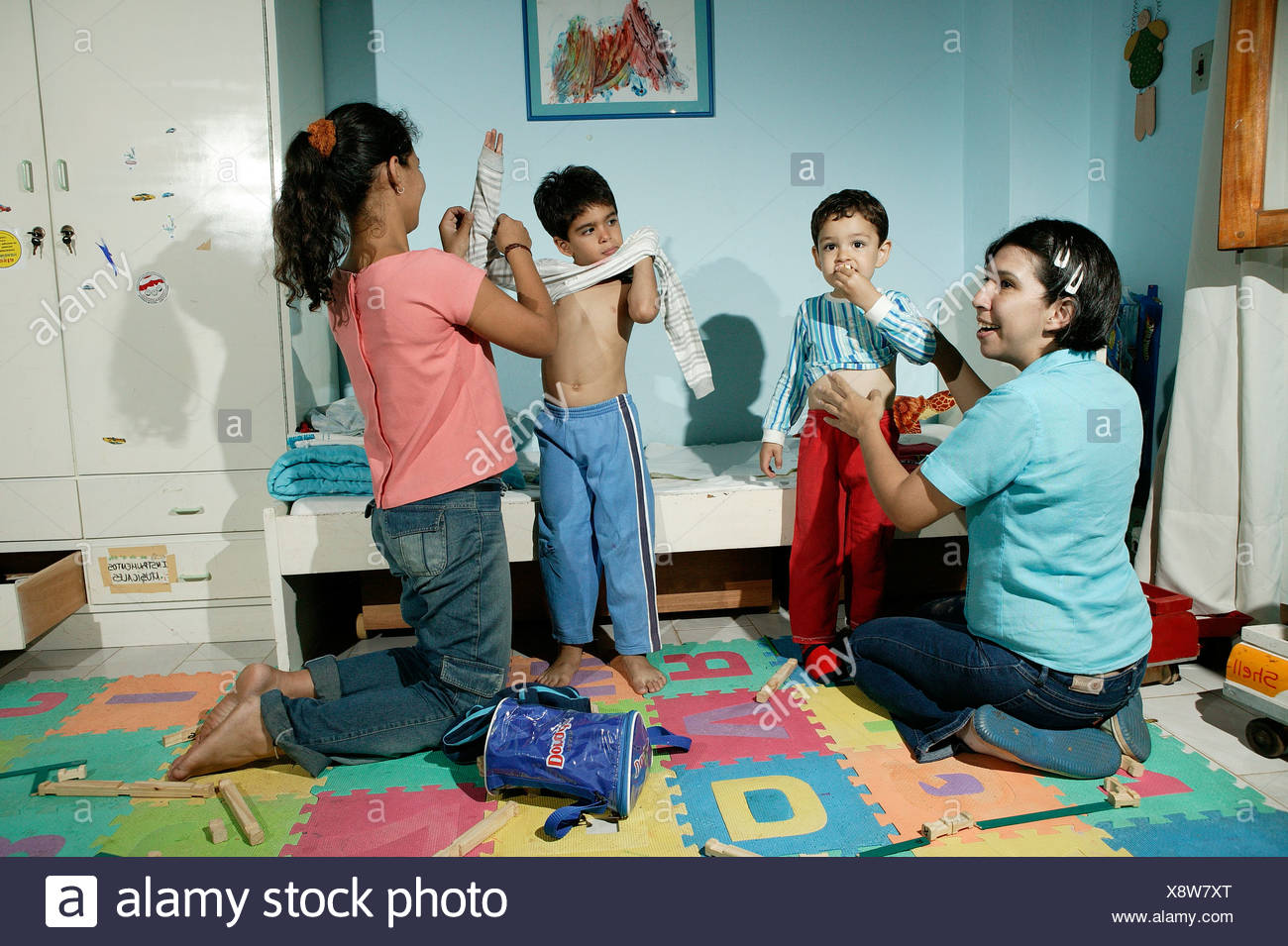 Help Get Dressed High Resolution Stock Photography and Images - Alamy