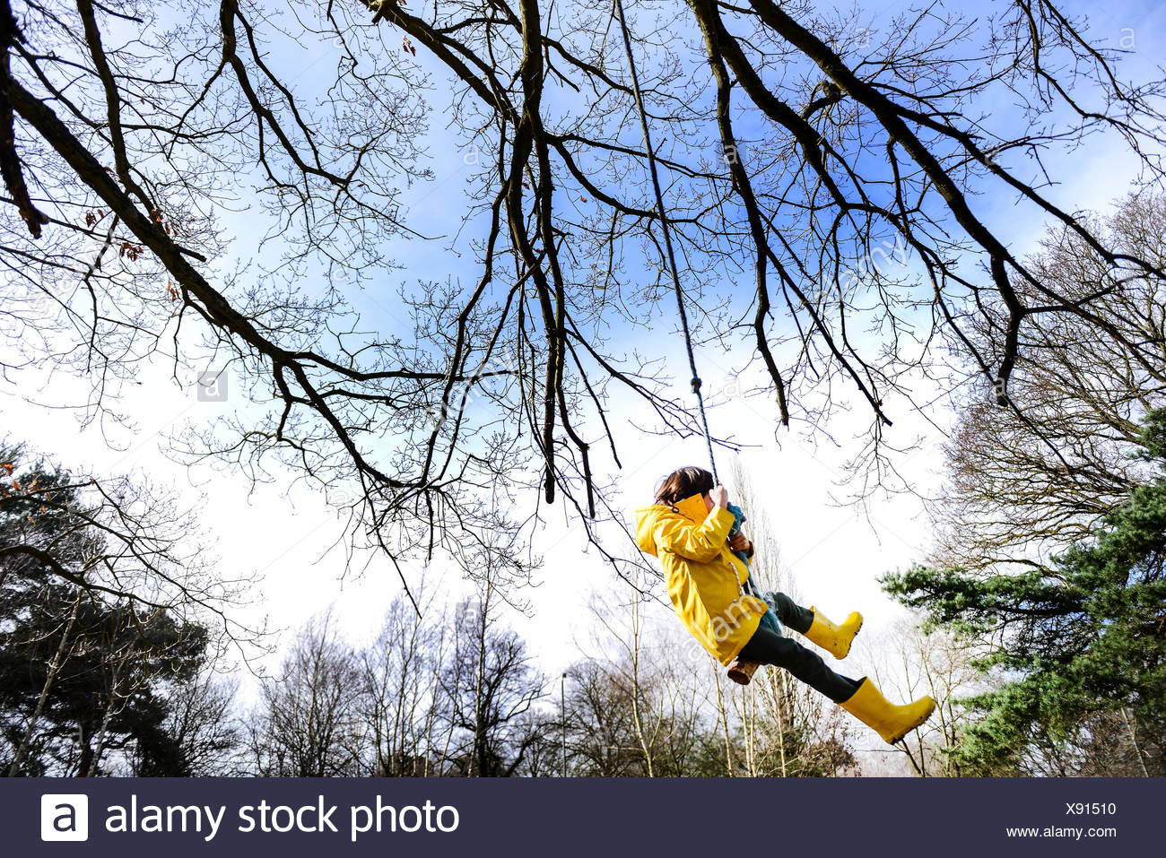 Boy Swinging From Tree High Resolution Stock Photography and Images - Alamy