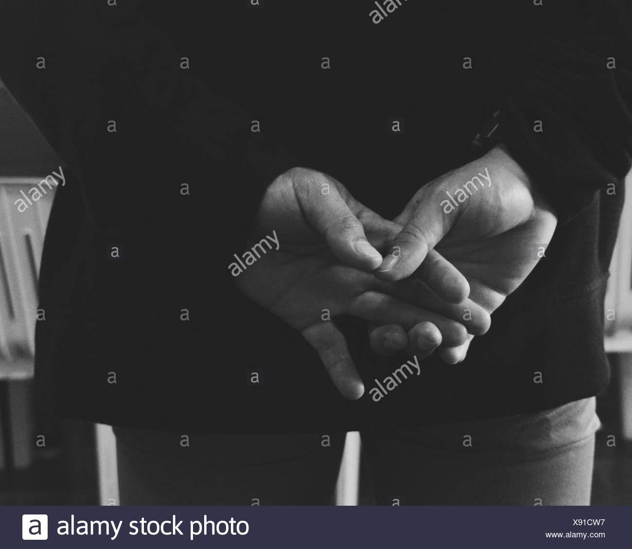 Hands Clasped Behind Back High Resolution Stock Photography and Images ...