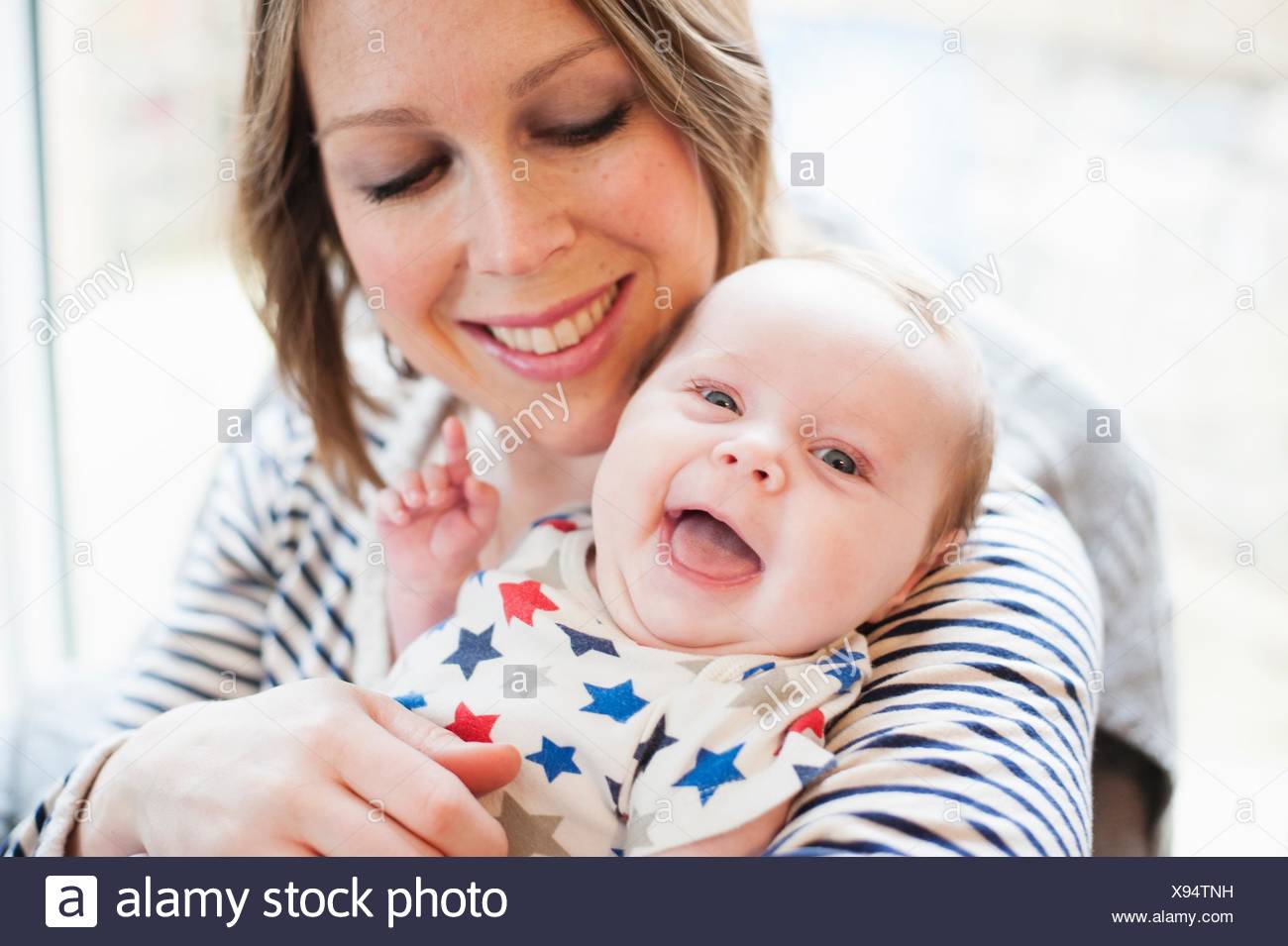 Mother Tickling Her Child High Resolution Stock Photography and Images ...