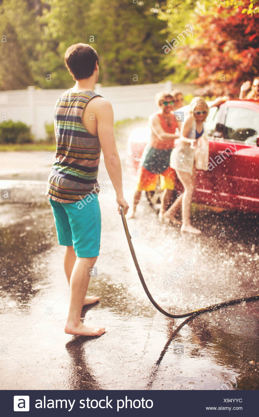 Man Holding Hose High Resolution Stock Photography and Images - Alamy