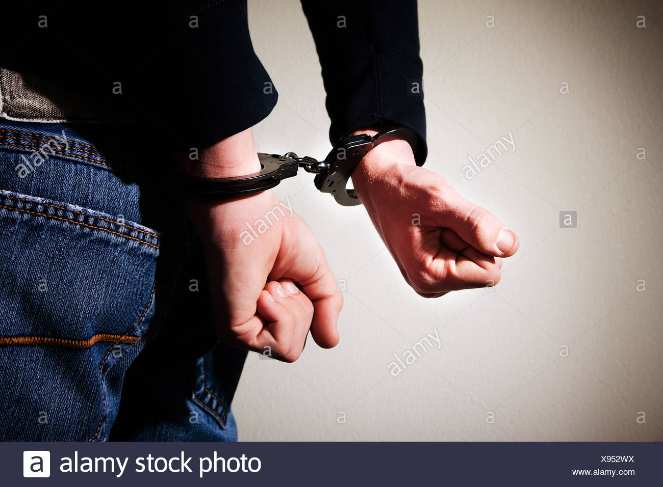 Hands Cuffed Behind Back Stock Photos & Hands Cuffed Behind Back Stock ...