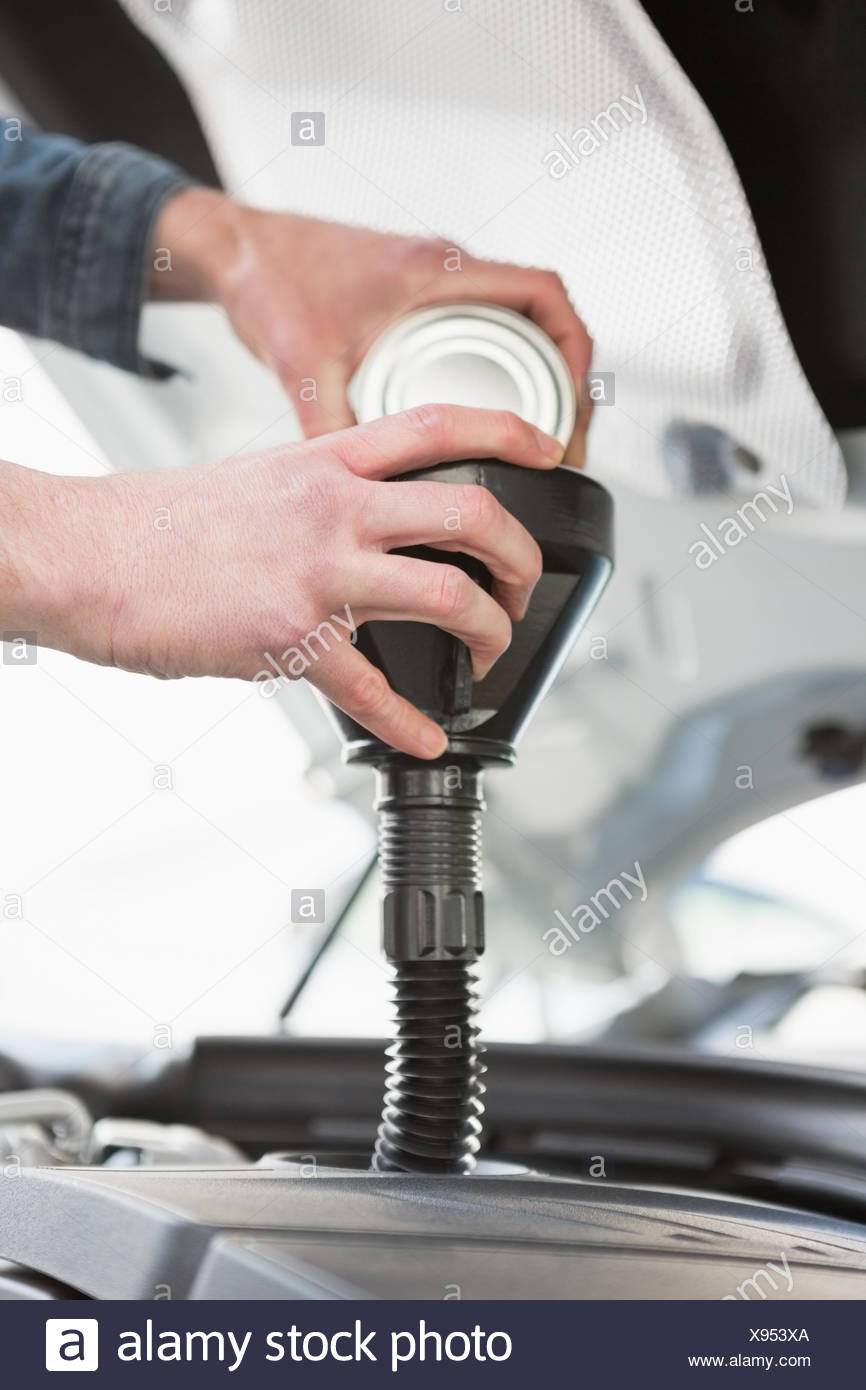 Man Pouring Oil Into Engine High Resolution Stock Photography and ...