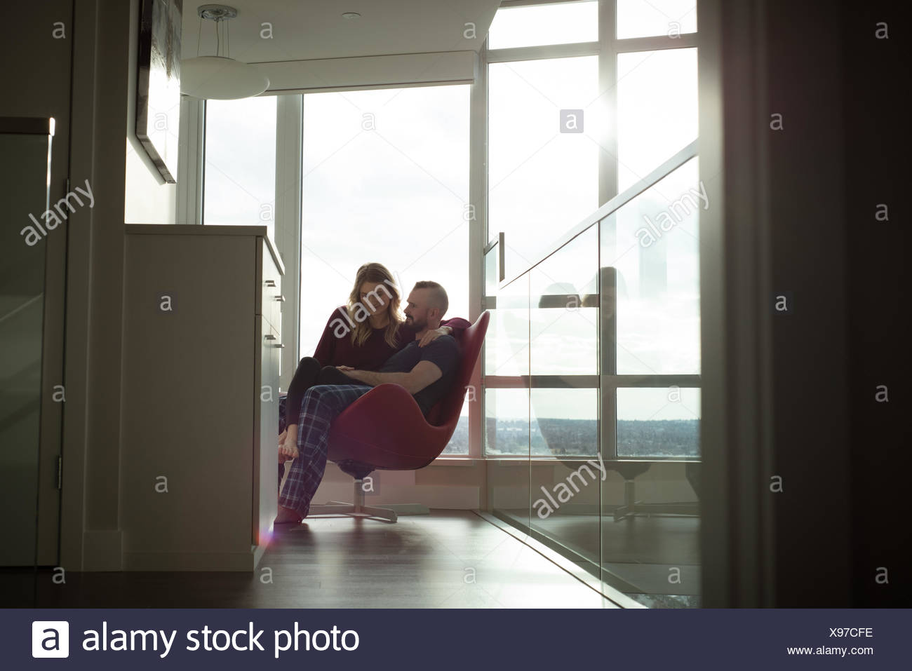 Romantic Couple Sitting On Chair High Resolution Stock Photography and ...