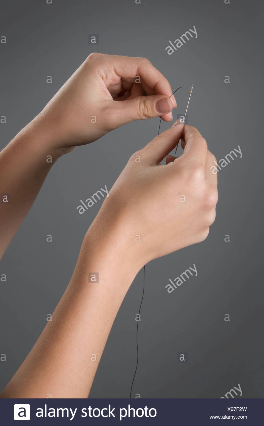 Threading Needle Stock Photos & Threading Needle Stock Images - Alamy