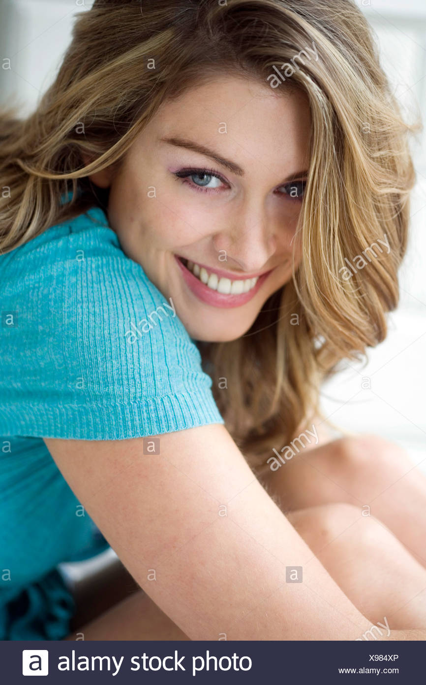 Sitting With Arms Around Knees Stock Photos & Sitting With Arms Around ...