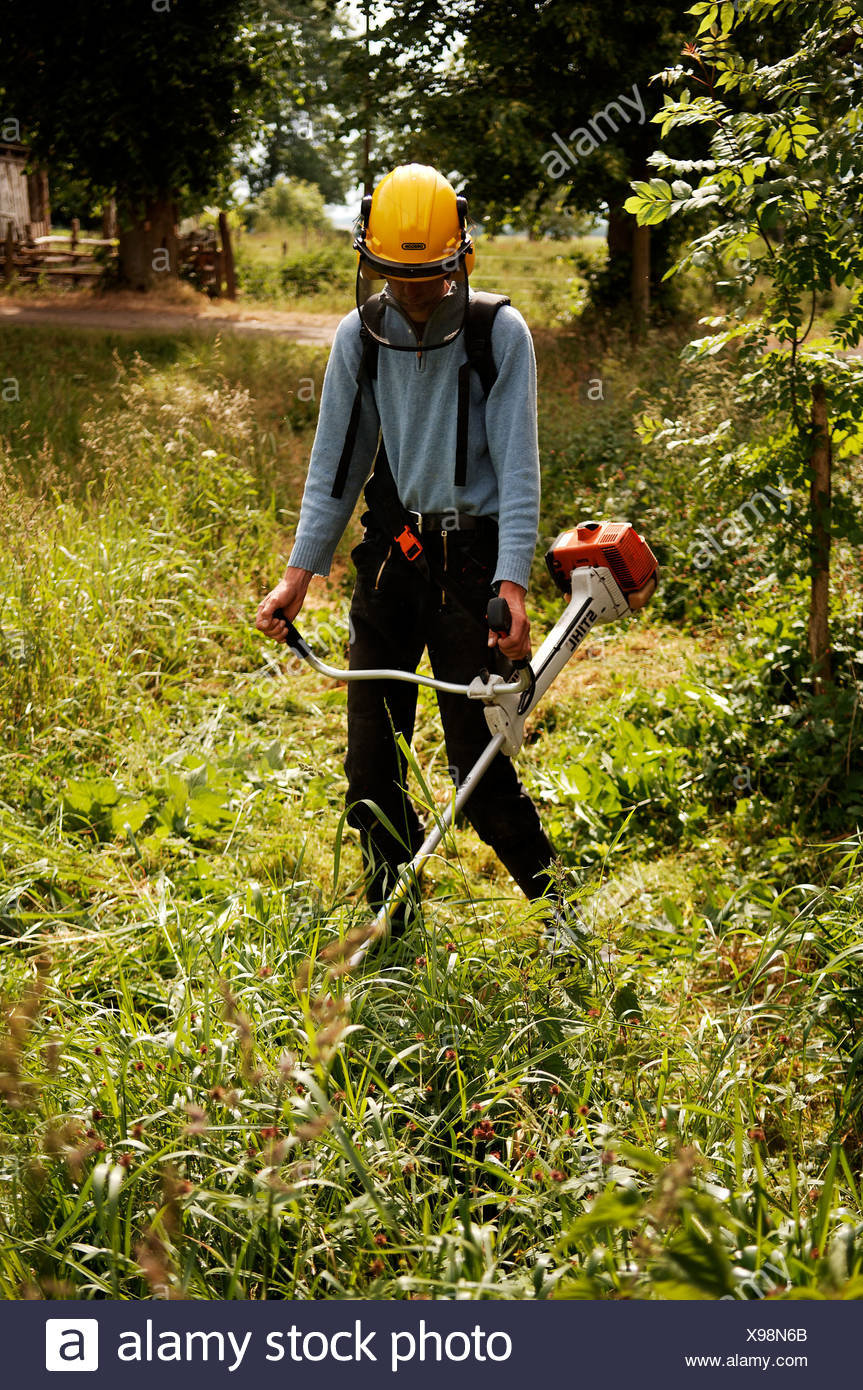 Farmer Cutting Grass With A Scythe High Resolution Stock Photography ...