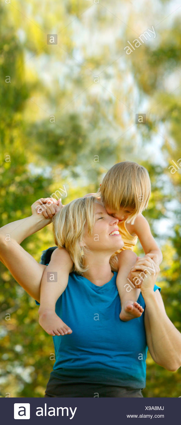 Child On Moms Shoulders High Resolution Stock Photography and Images ...