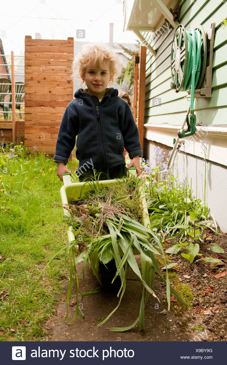 Wheelbarrow Children Wheelbarrow High Resolution Stock Photography and ...