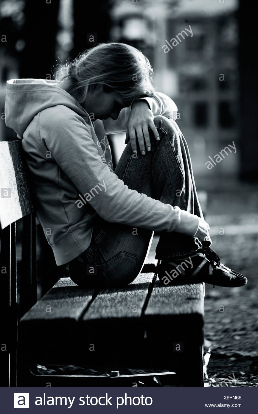 Crouching Down Sad High Resolution Stock Photography and Images - Alamy