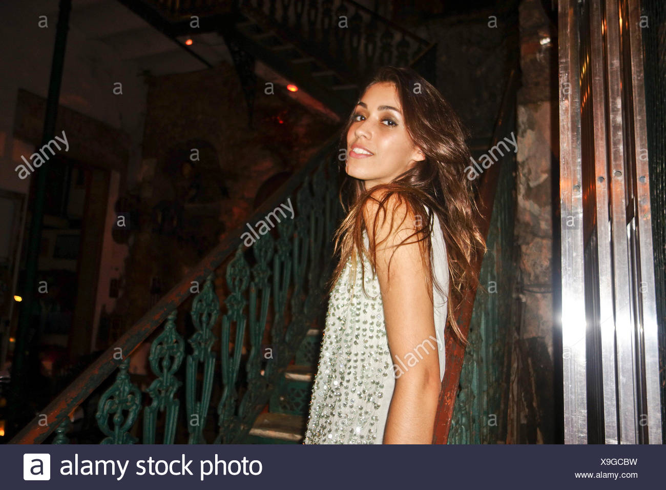 Woman Bottom Of Stairs High Resolution Stock Photography and Images - Alamy
