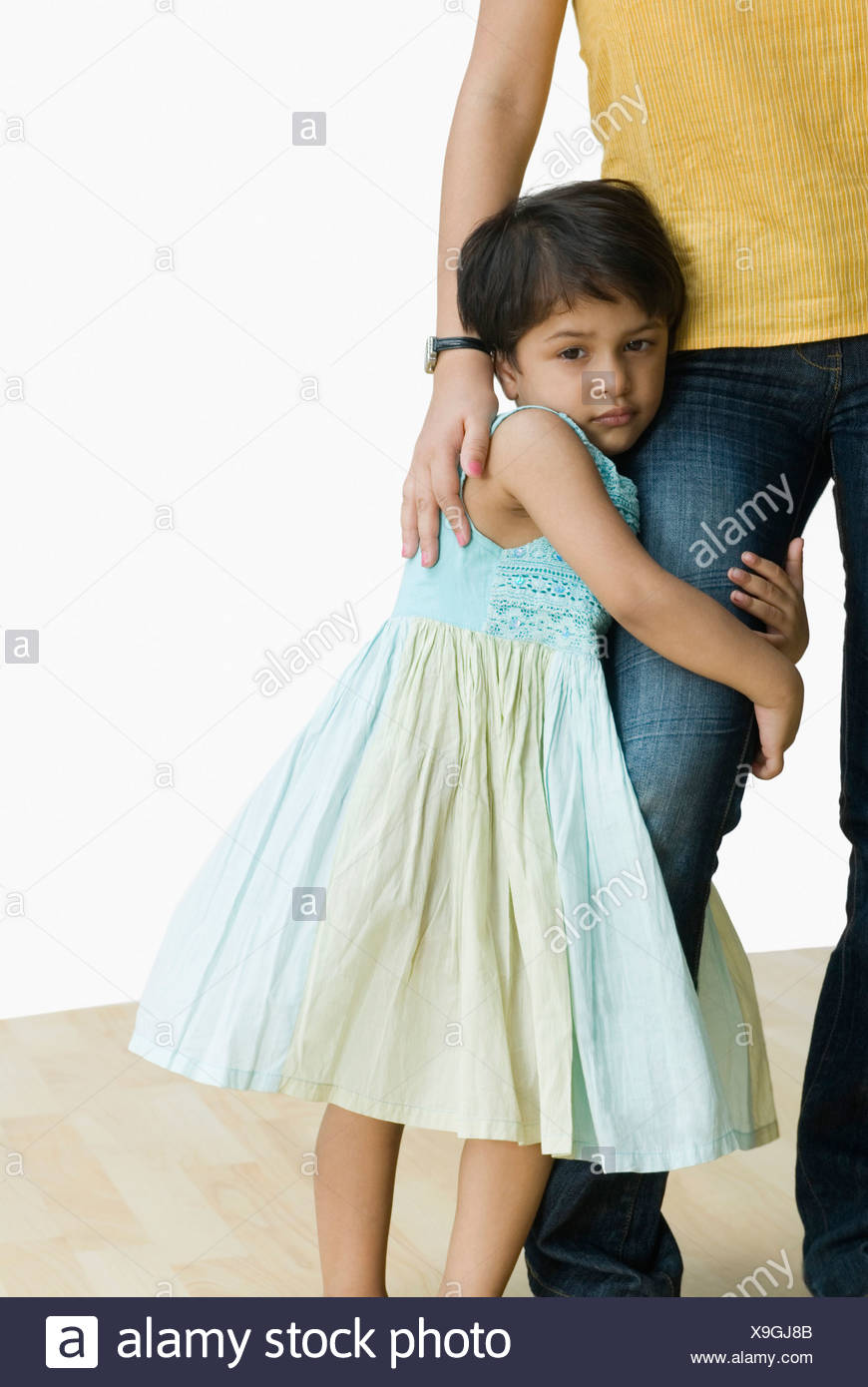 Child Hugging Parent Leg Stock Photos & Child Hugging Parent Leg Stock ...